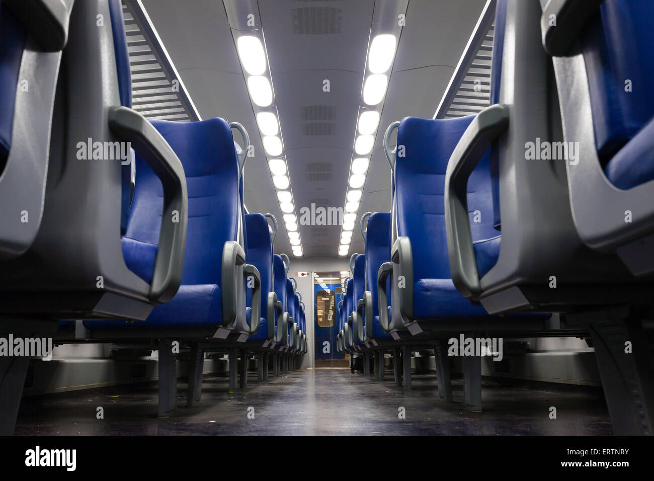Perspective view of seats from the aisle inside a passenger train Stock ...