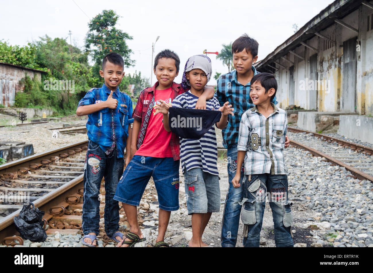 a group of children playing on railway station Stock Photo - Alamy