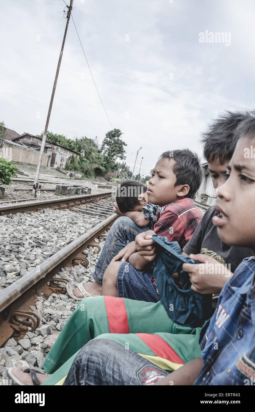 a group of children playing on railway station Stock Photo - Alamy