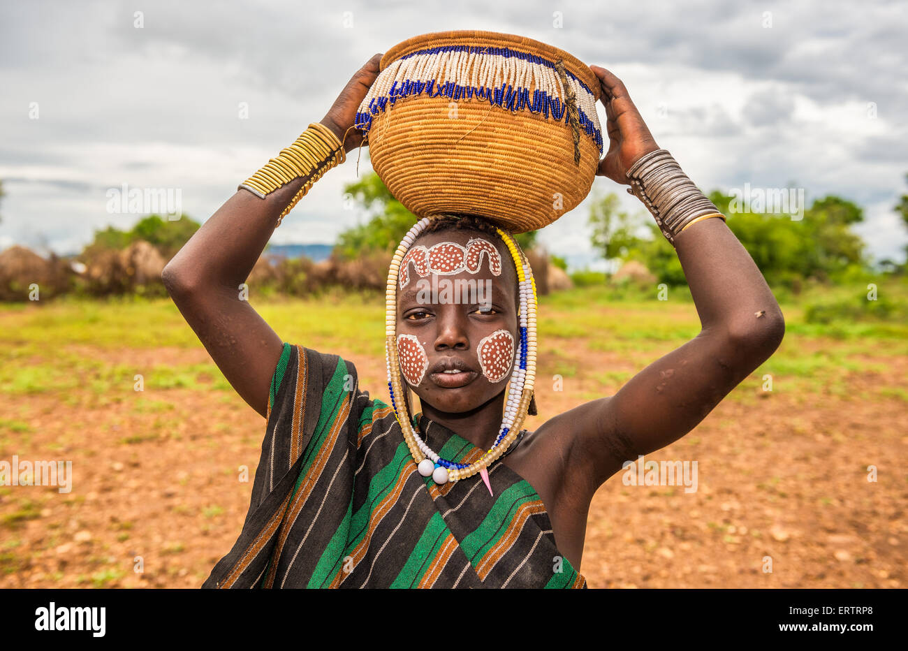 Young boy from the African tribe Mursi with traditional jewelry in Mago ...