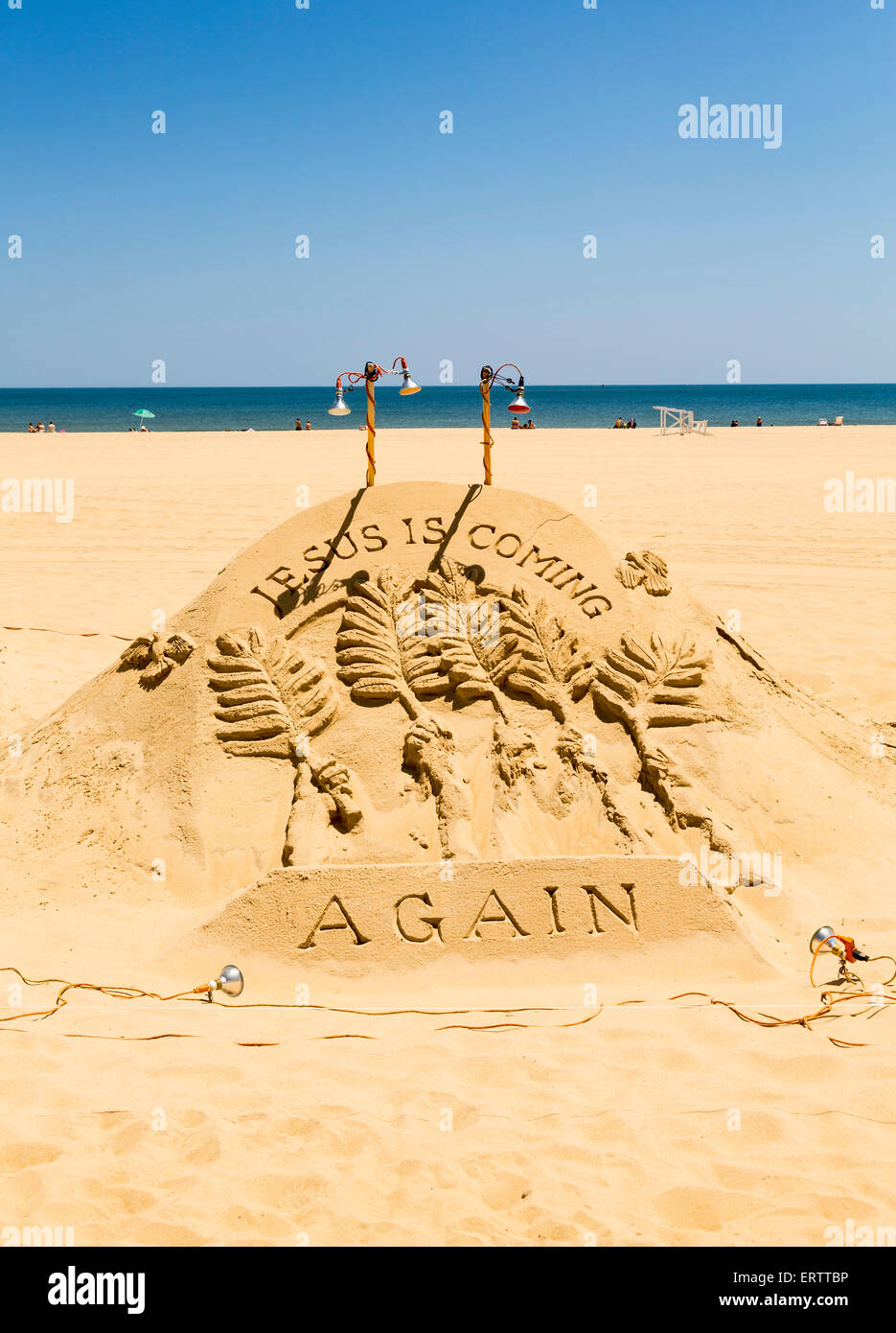 Religious sand sculpture or carving on beach on the US East Coast, USA ...