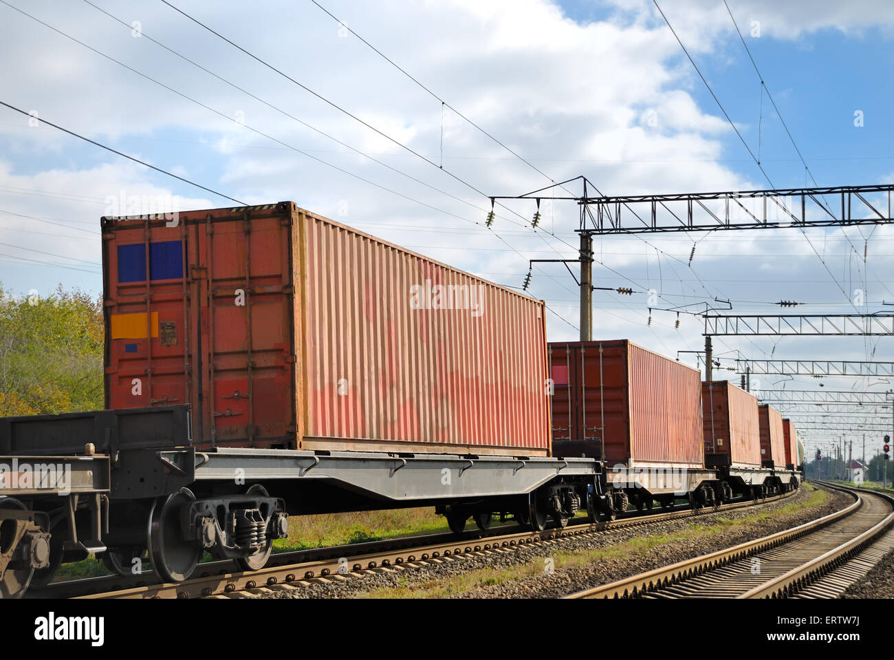 The train transportation of cargoes by rail in containers Stock Photo ...