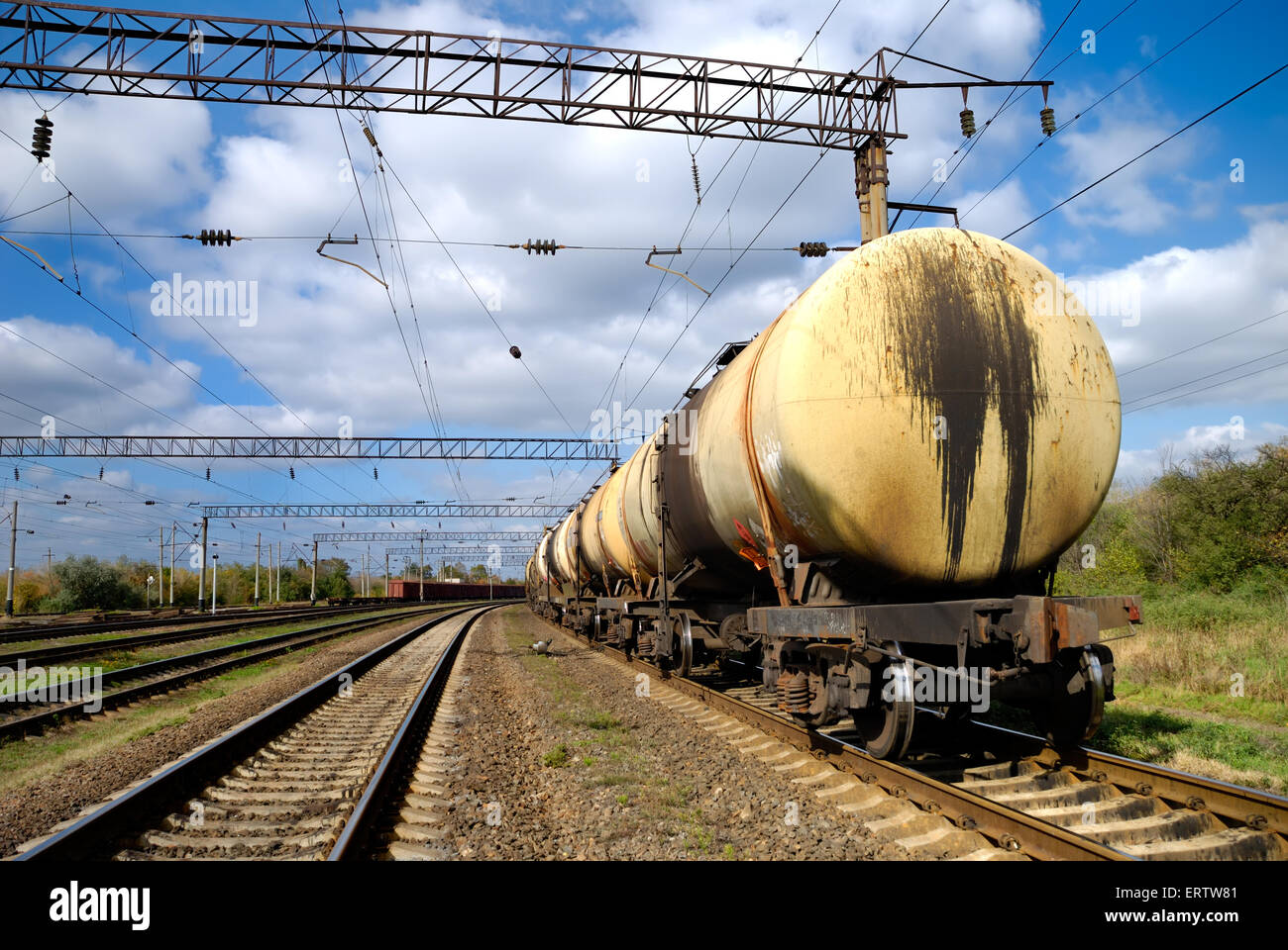 Back part of the train transporting tanks with oil Stock Photo - Alamy