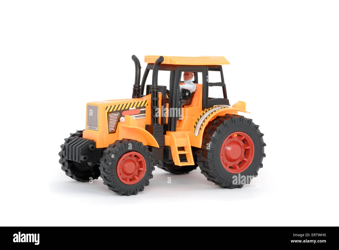 Small yellow toy tractor isolated on white Stock Photo - Alamy