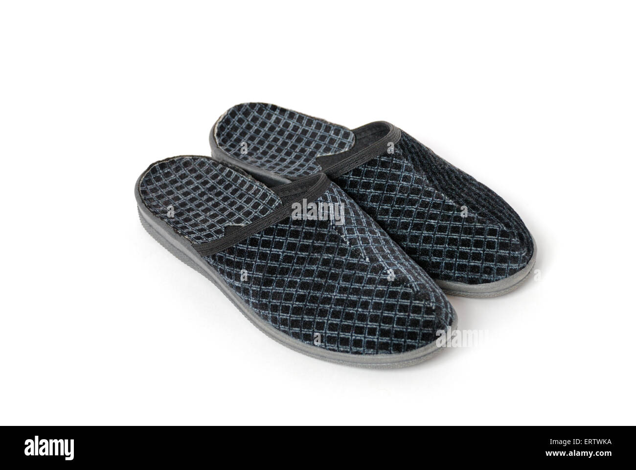 Two domestic grey slippers isolated on white Stock Photo - Alamy