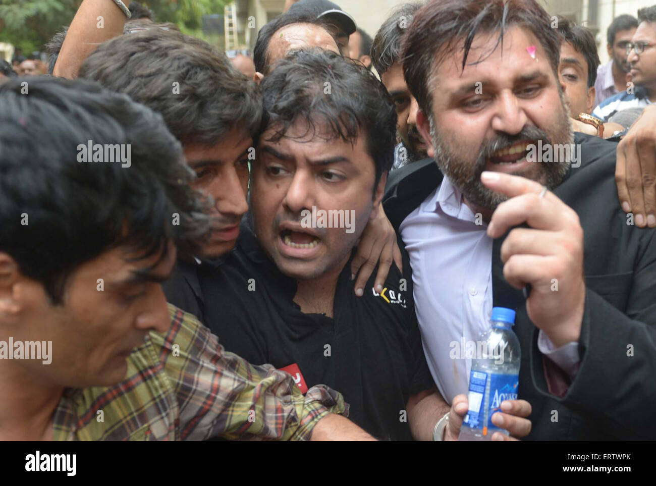 CEO of Axact, Shoaib Sheikh is being escorting by FIA staffs as he ...