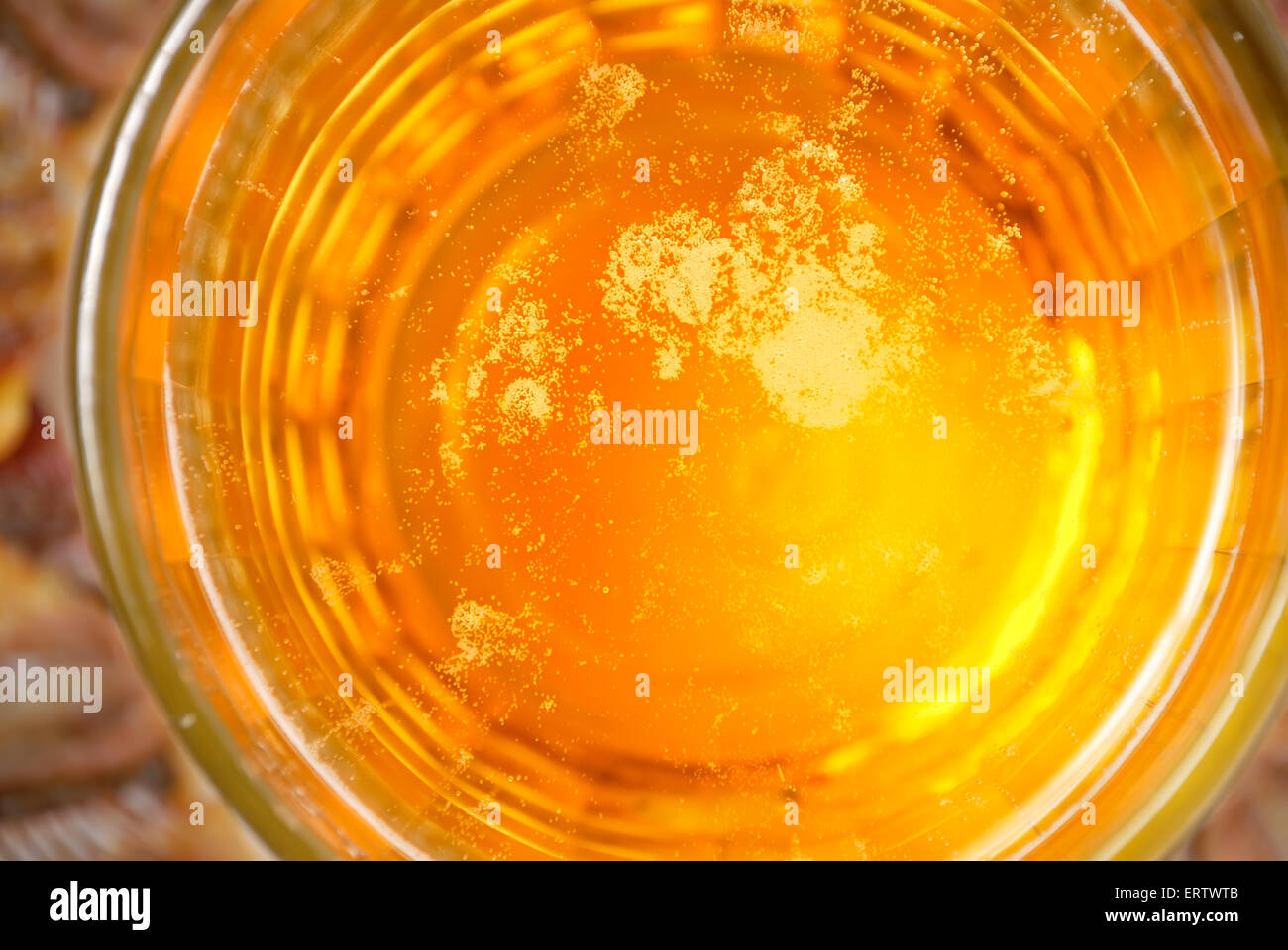 The surface of beer glass with fish background Stock Photo - Alamy