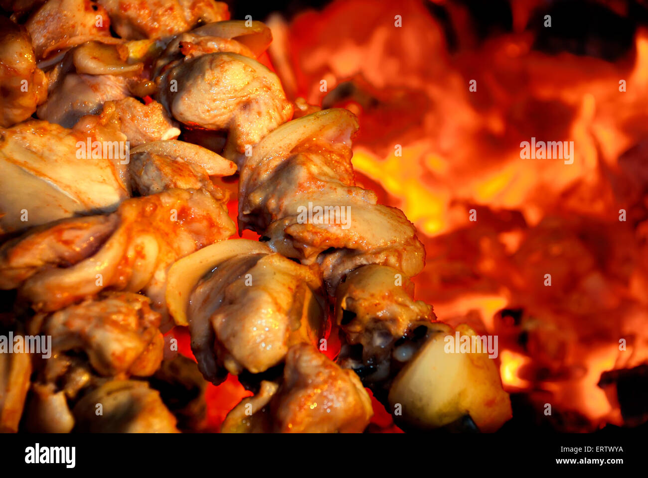 Traditional preparation of a shish kebab on fire Stock Photo - Alamy