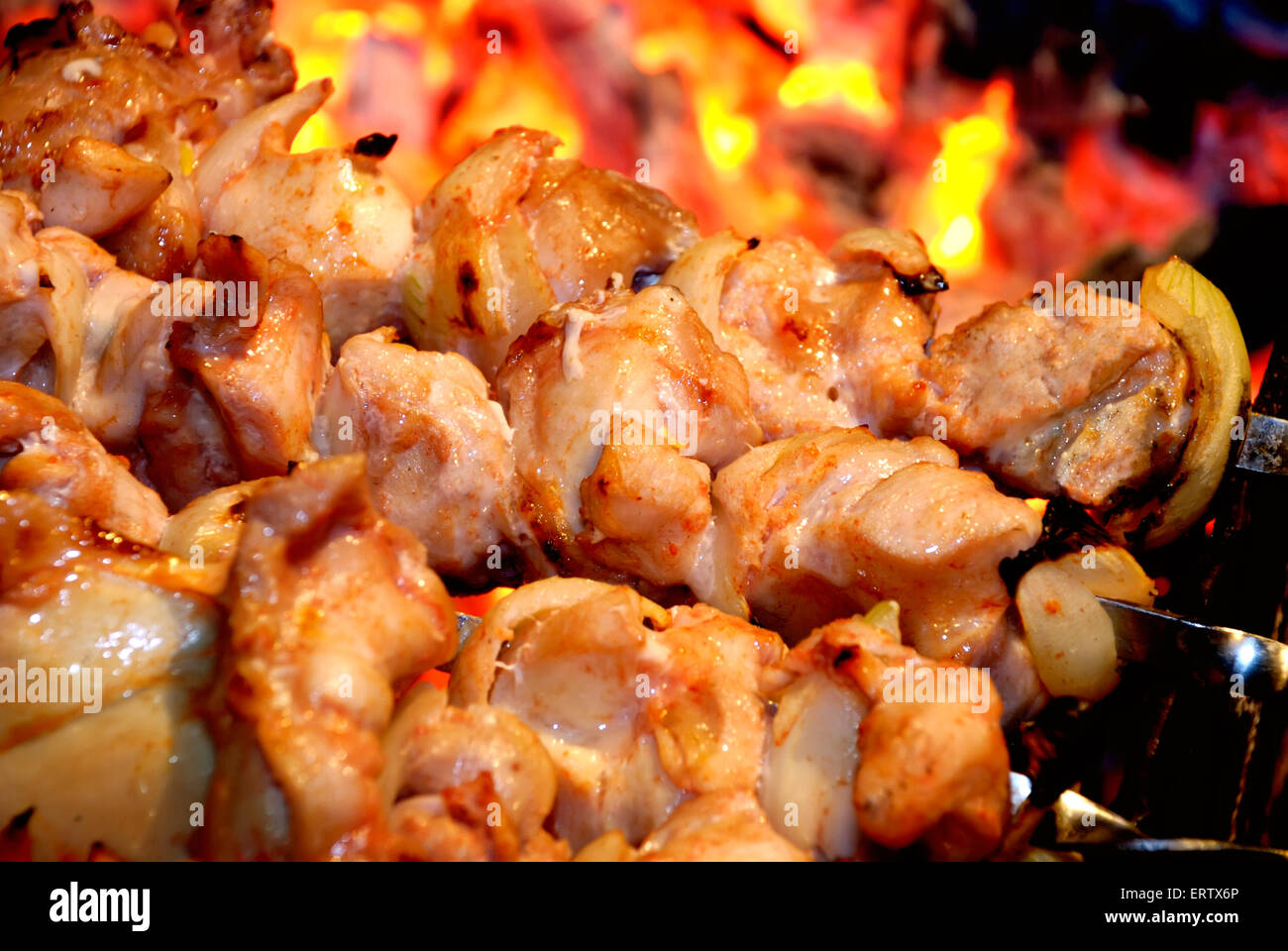 Traditional preparation of a shish kebab on fire Stock Photo - Alamy