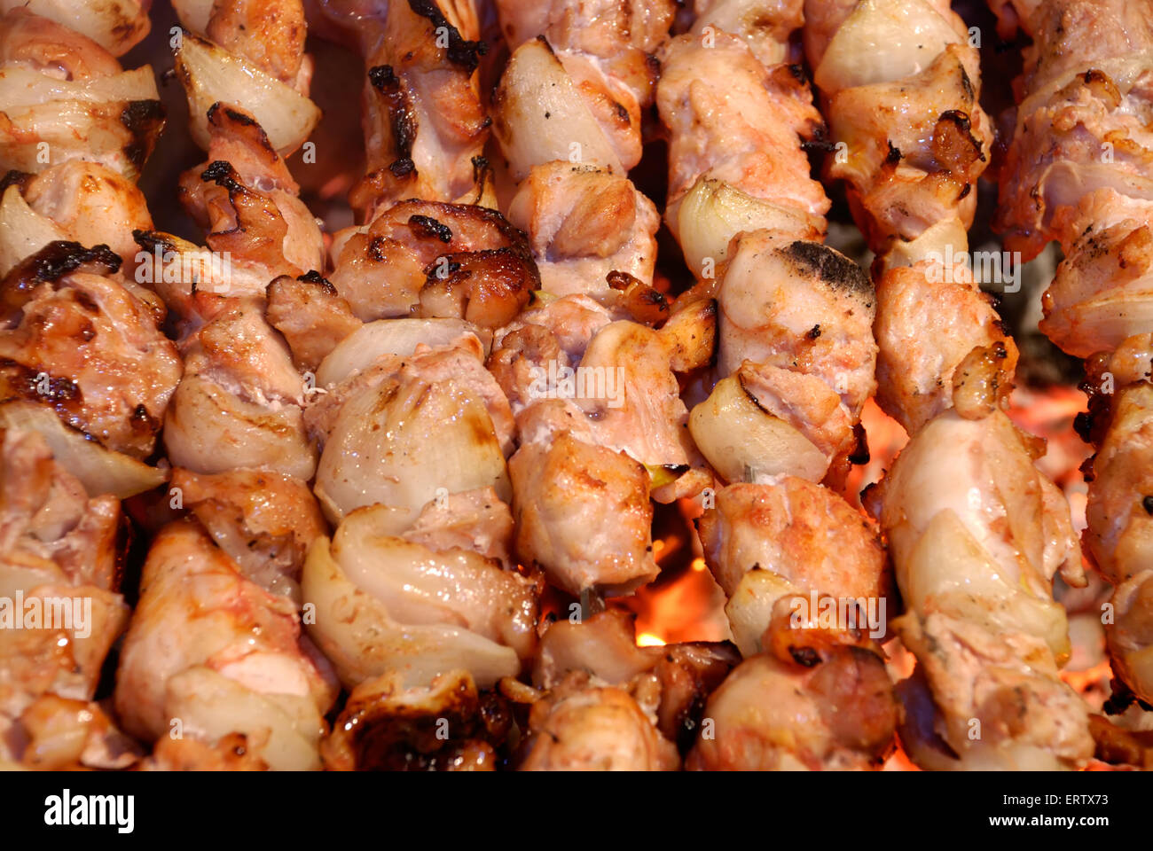 Traditional preparation of a shish kebab on fire Stock Photo - Alamy