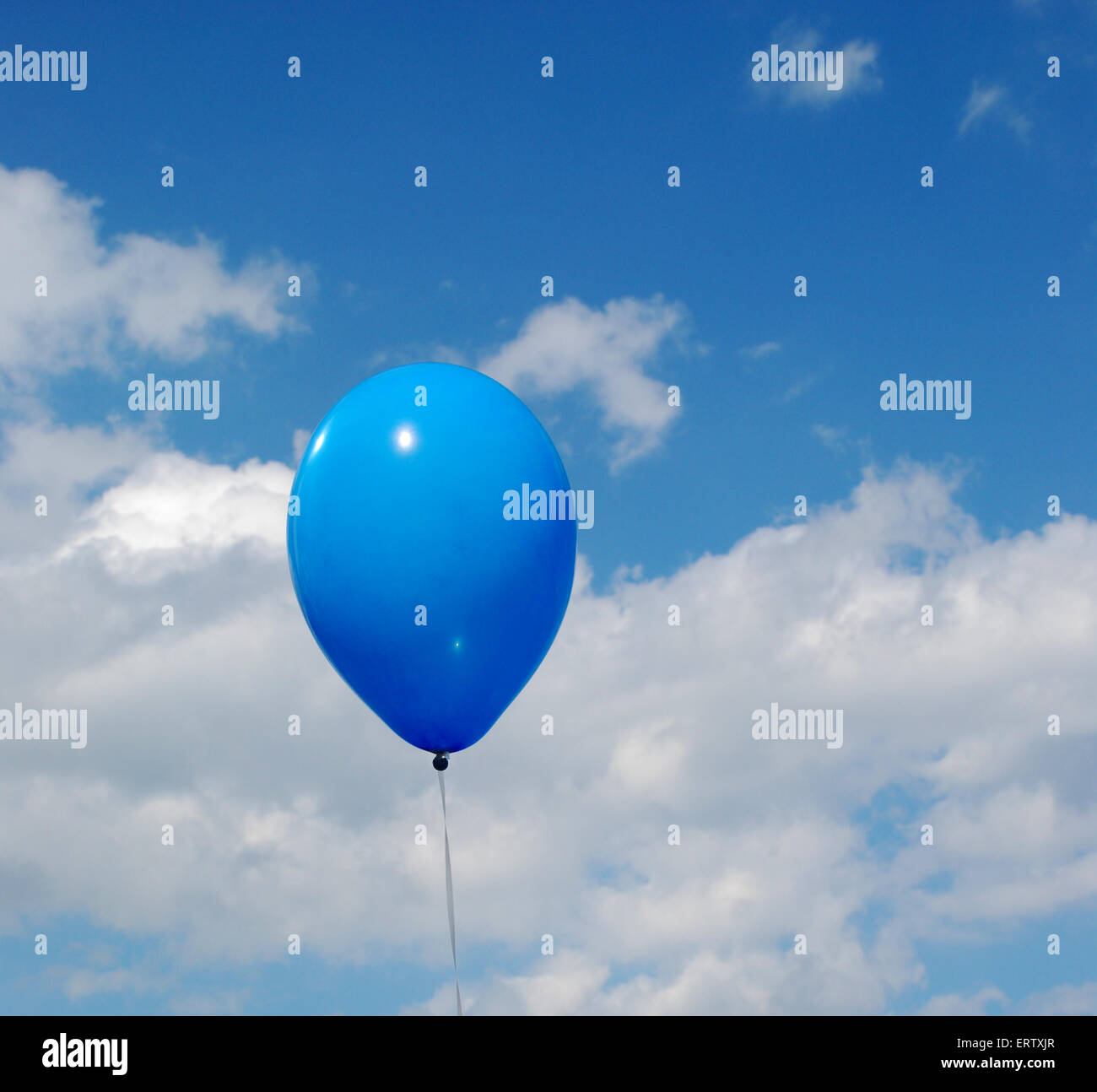 The blue ball flies up in the sky Stock Photo - Alamy