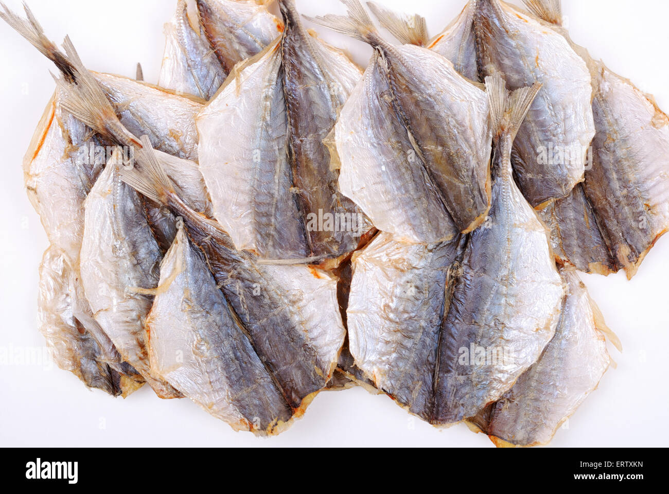 Stack of fish isolated on white background Stock Photo - Alamy