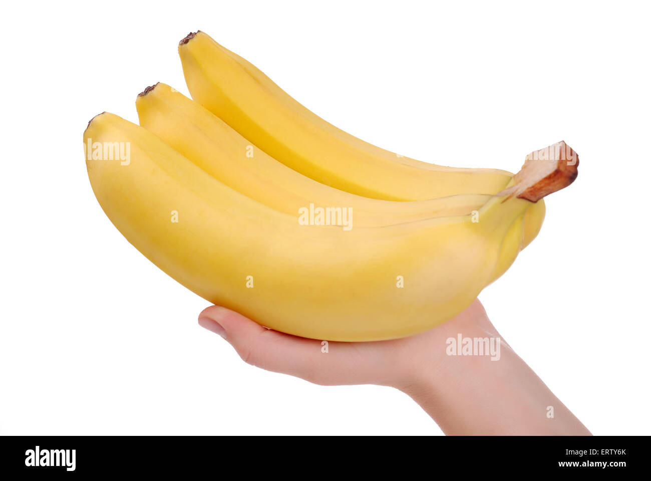 The bunch of bananas in woman hand on white background Stock Photo - Alamy