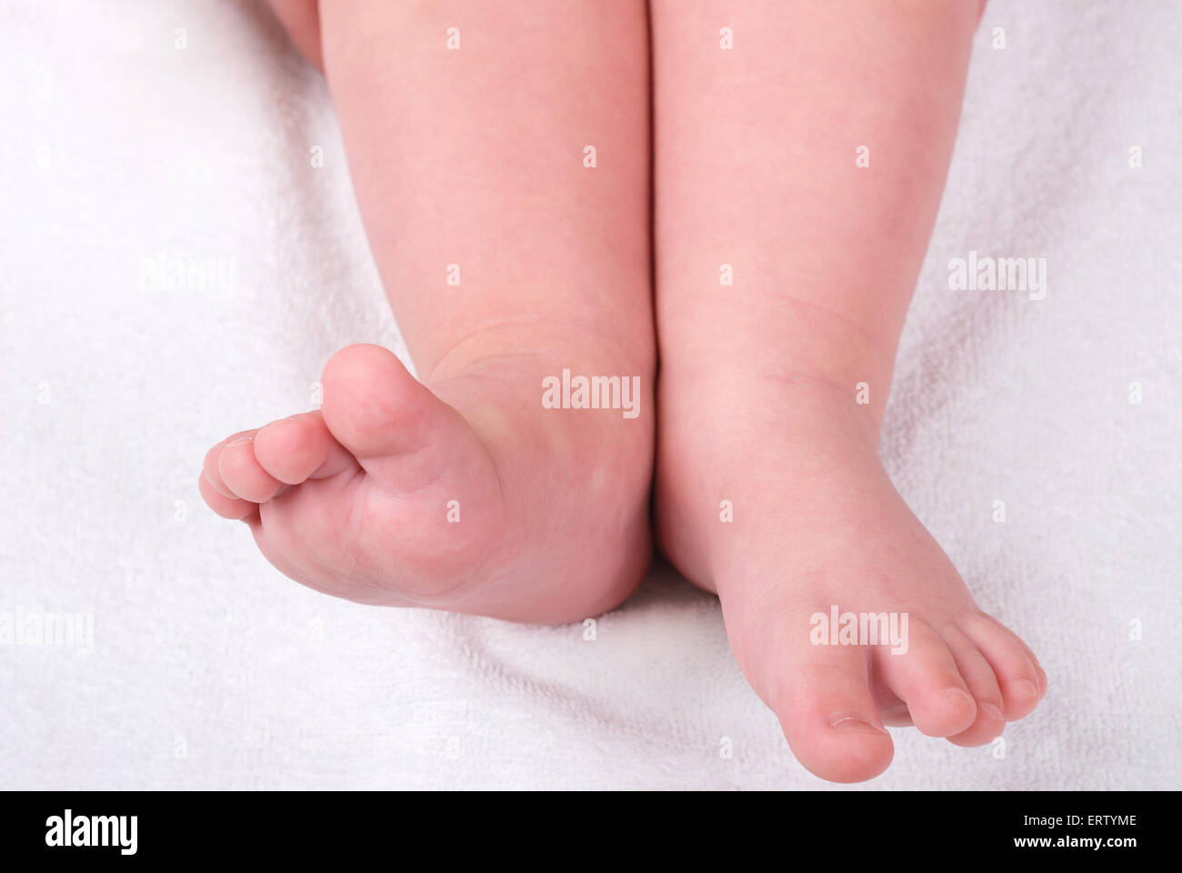 Children's legs on a soft light towel Stock Photo - Alamy