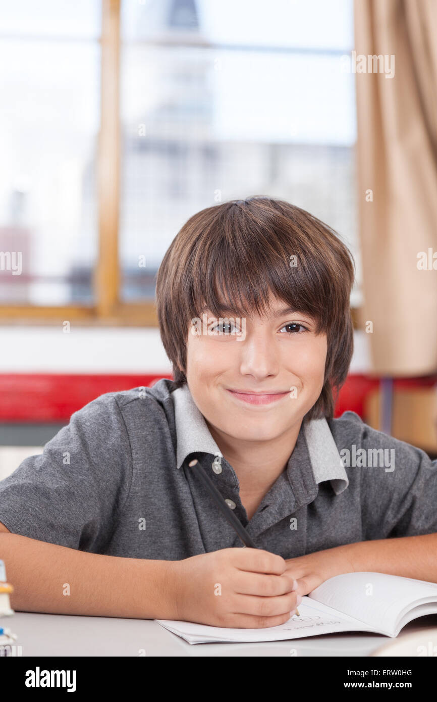 Boy in the class room Stock Photo - Alamy