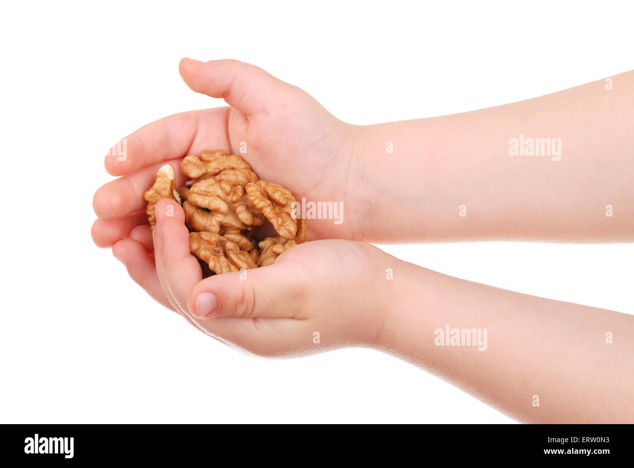 The children's hand holds nuts isolated Stock Photo - Alamy