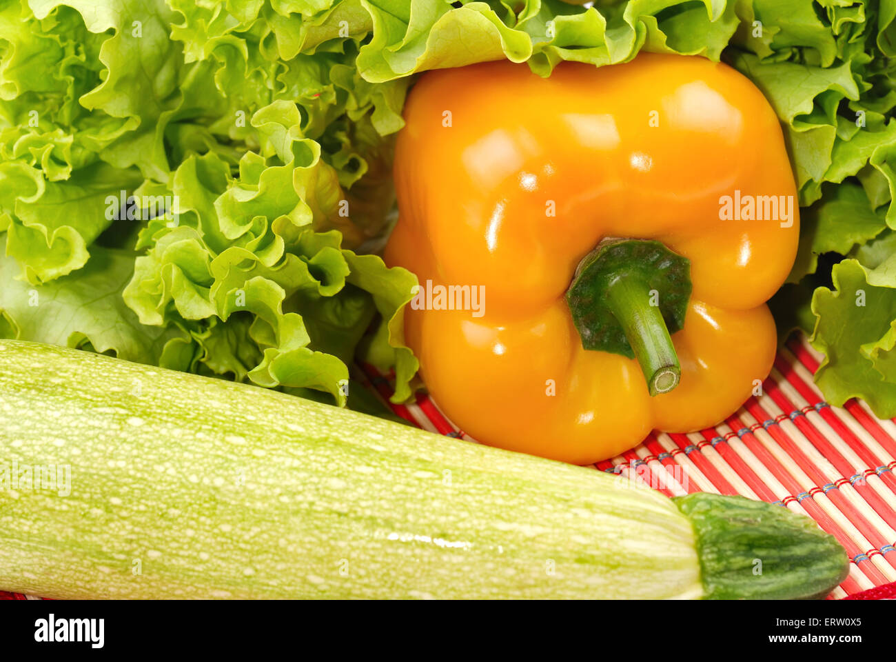 Vegetables. Yellow pepper, squash and greens Stock Photo - Alamy