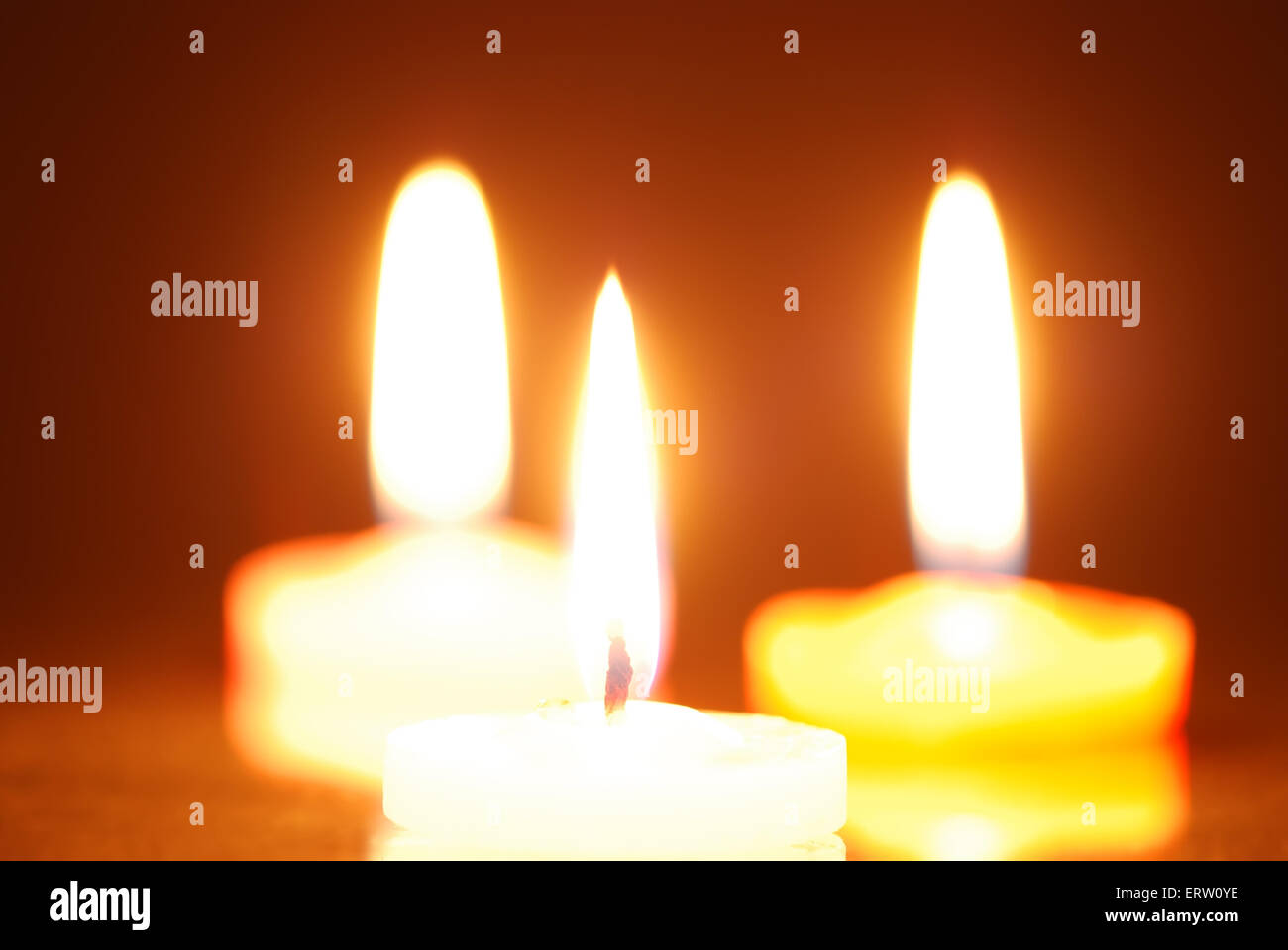 Closeup of high contrast burning candle Stock Photo - Alamy