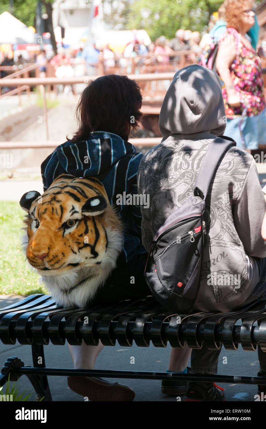 Girl with tiger backpack Stock Photo - Alamy