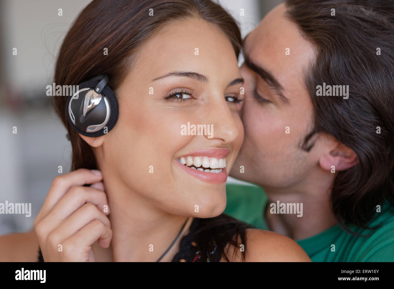 Man whispering woman's ear hi-res stock photography and images - Alamy