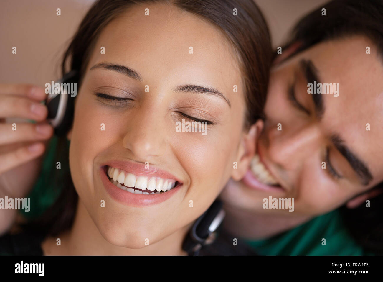 Man whispering woman's ear hi-res stock photography and images - Alamy