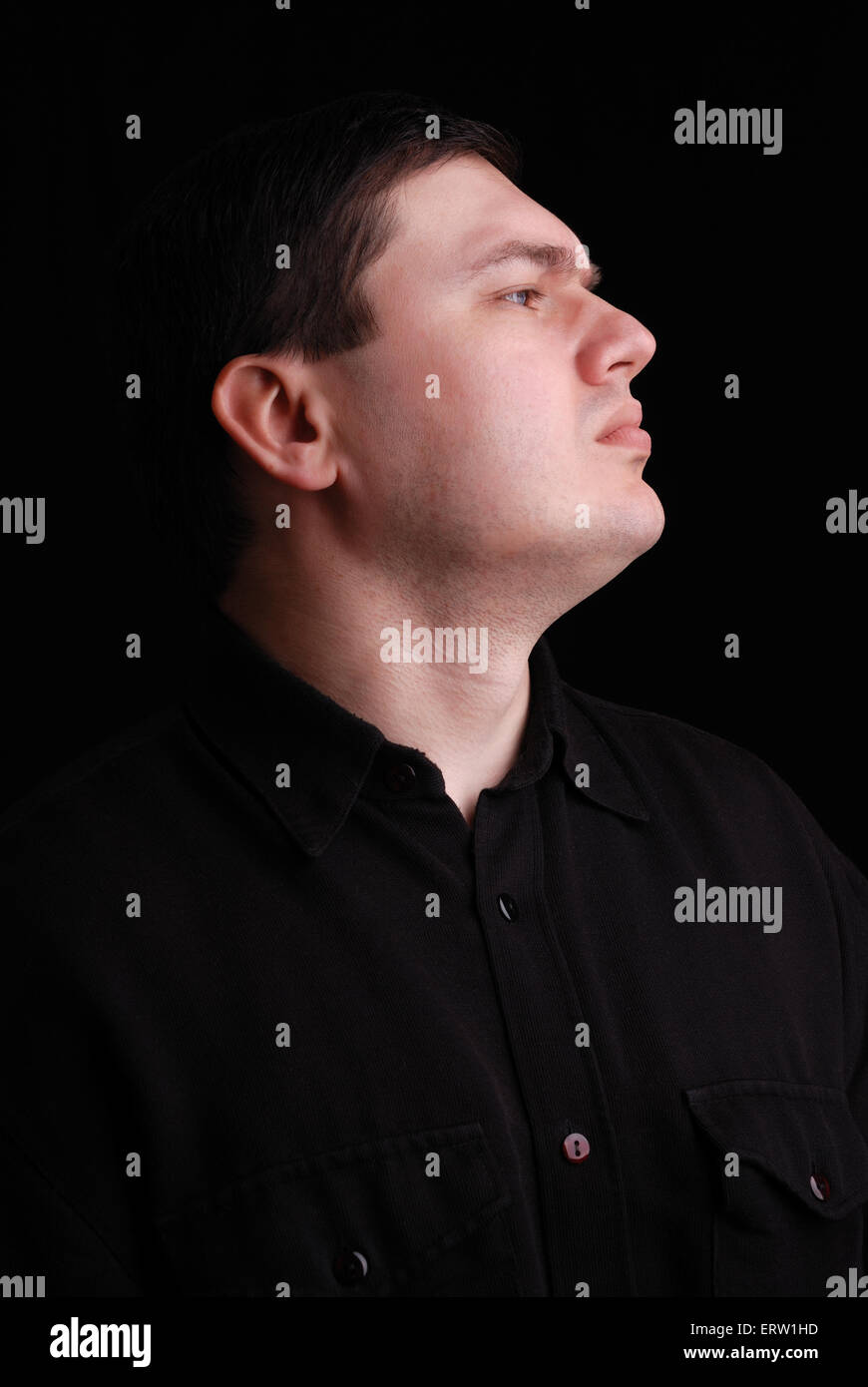 Profile portrait of young caucasian man in black Stock Photo - Alamy