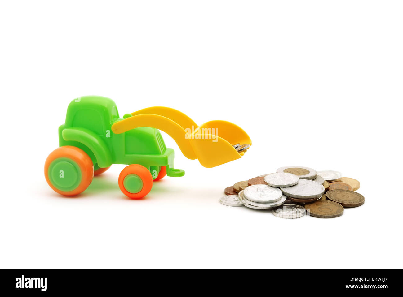 The toy excavator loads money on white background Stock Photo - Alamy