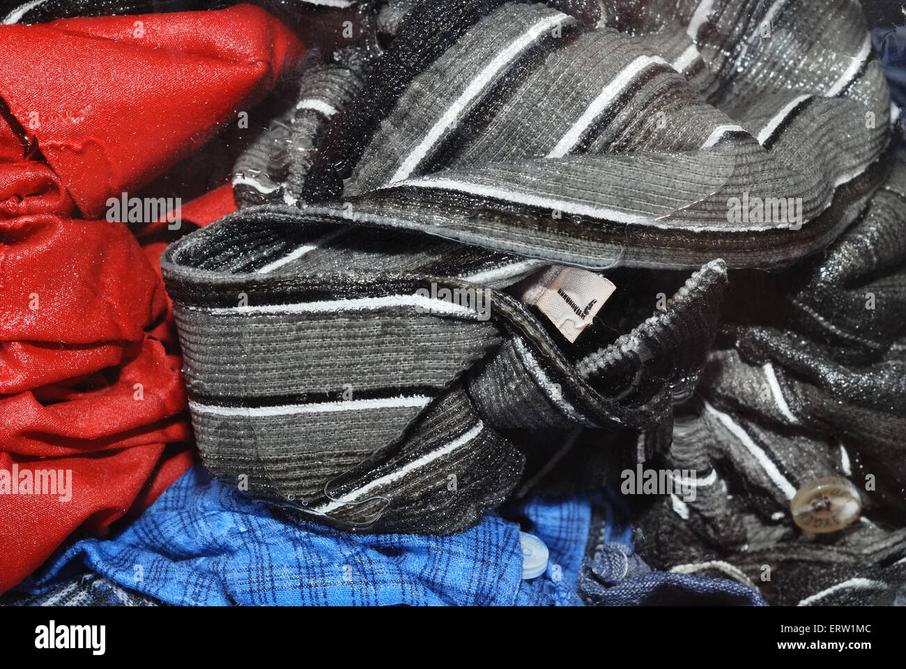 The washing machine processing a colorful clothes Stock Photo - Alamy