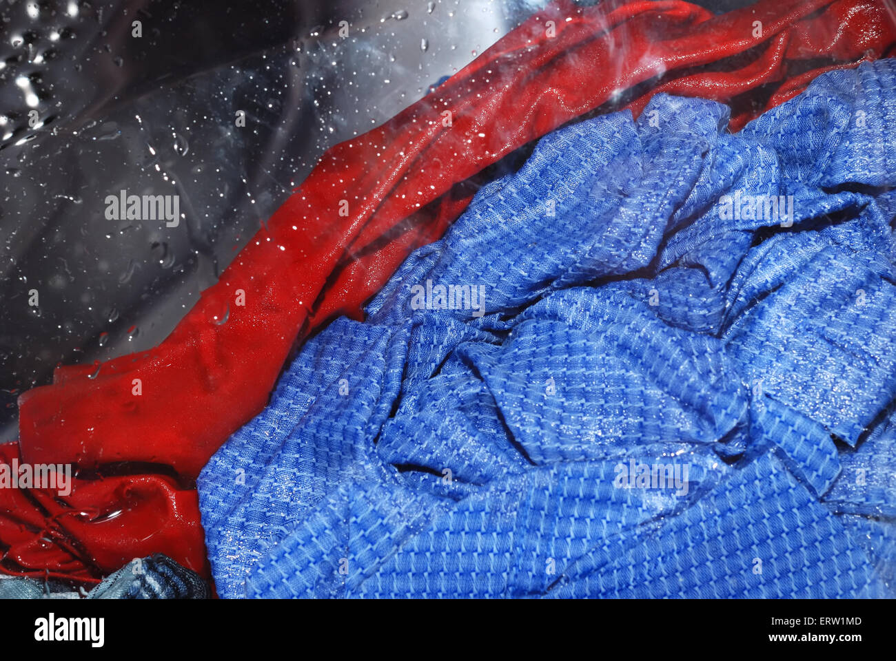 The washing machine processing a colorful clothes Stock Photo - Alamy
