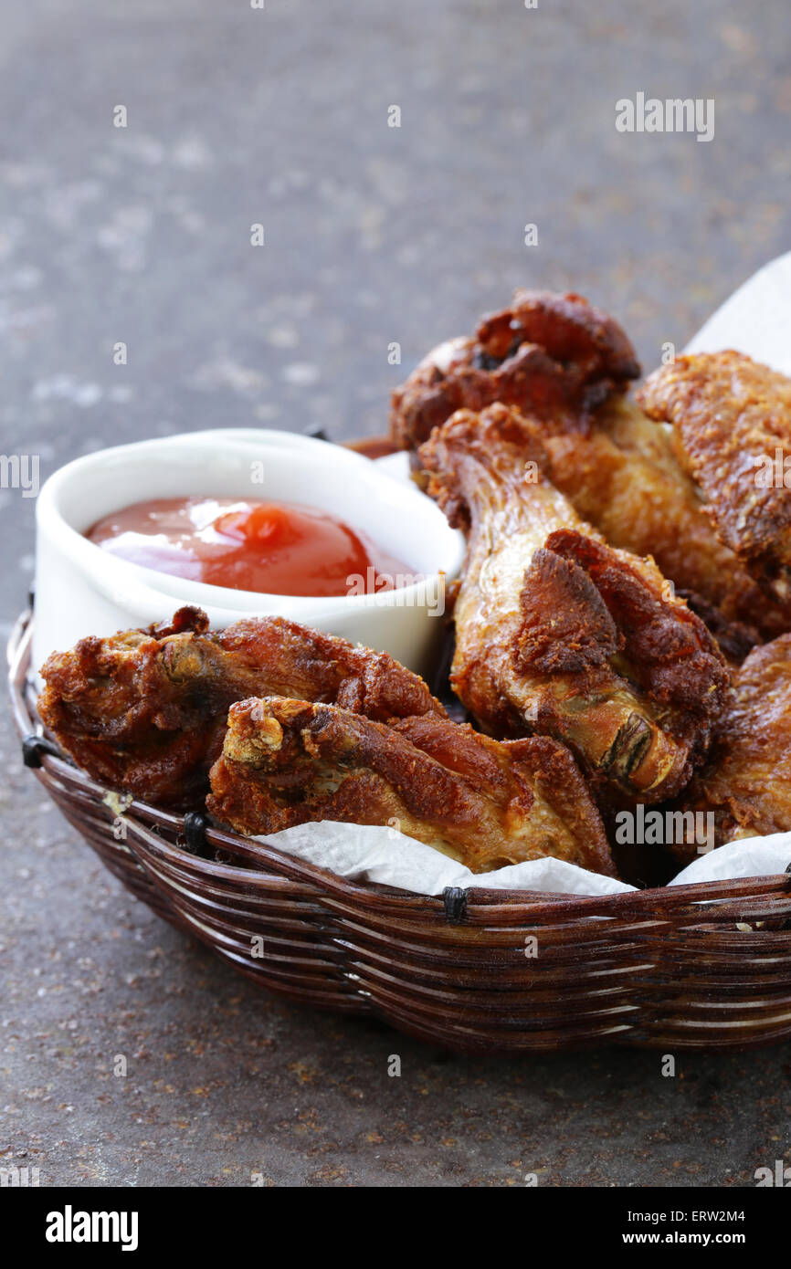 Fried chicken wings with sauce and spices Stock Photo - Alamy
