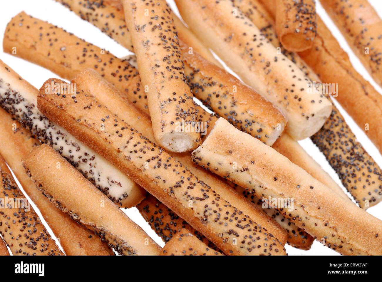 Stack of salted breadsticks with poppy seed isolated on white Stock ...