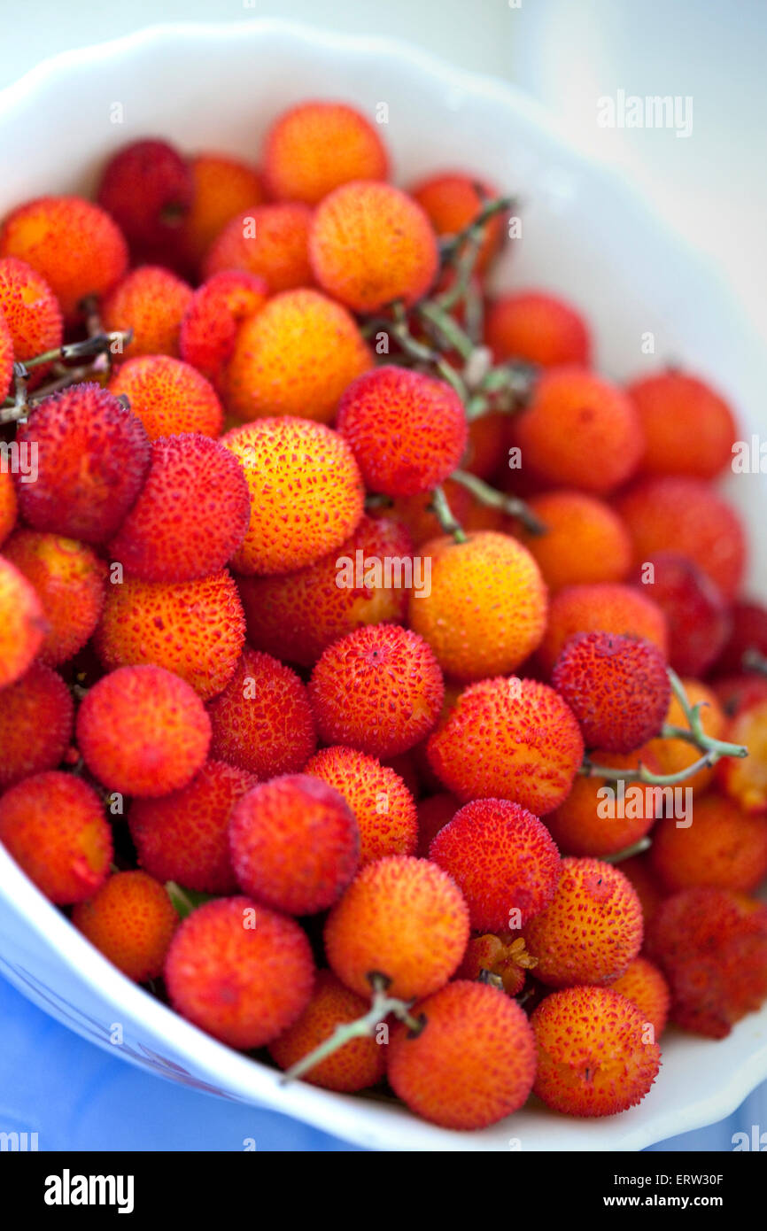 Close up of arbutus fruits on a plate Stock Photo - Alamy