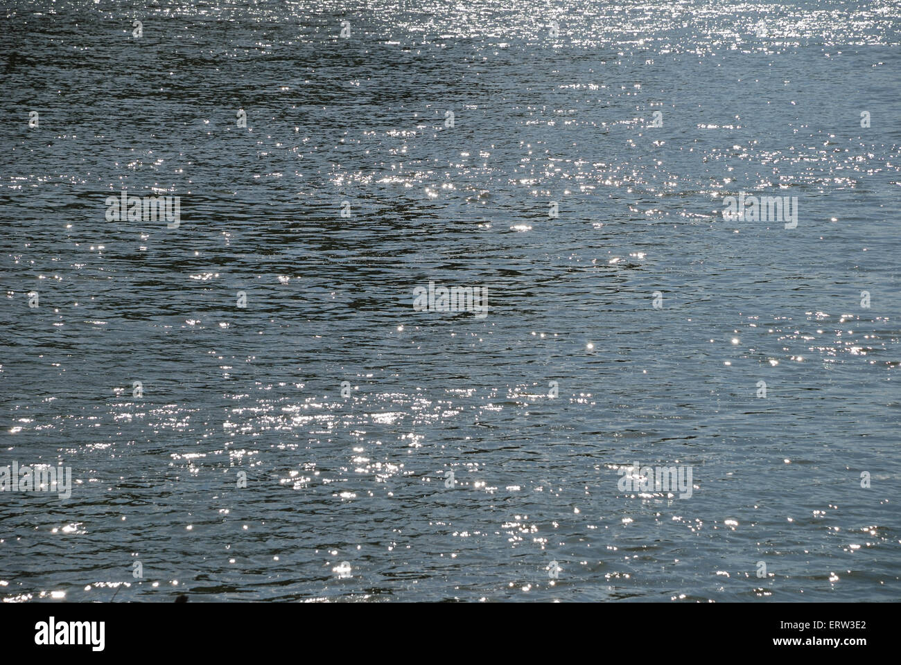 Background of a river surface shining from a sunlight Stock Photo - Alamy