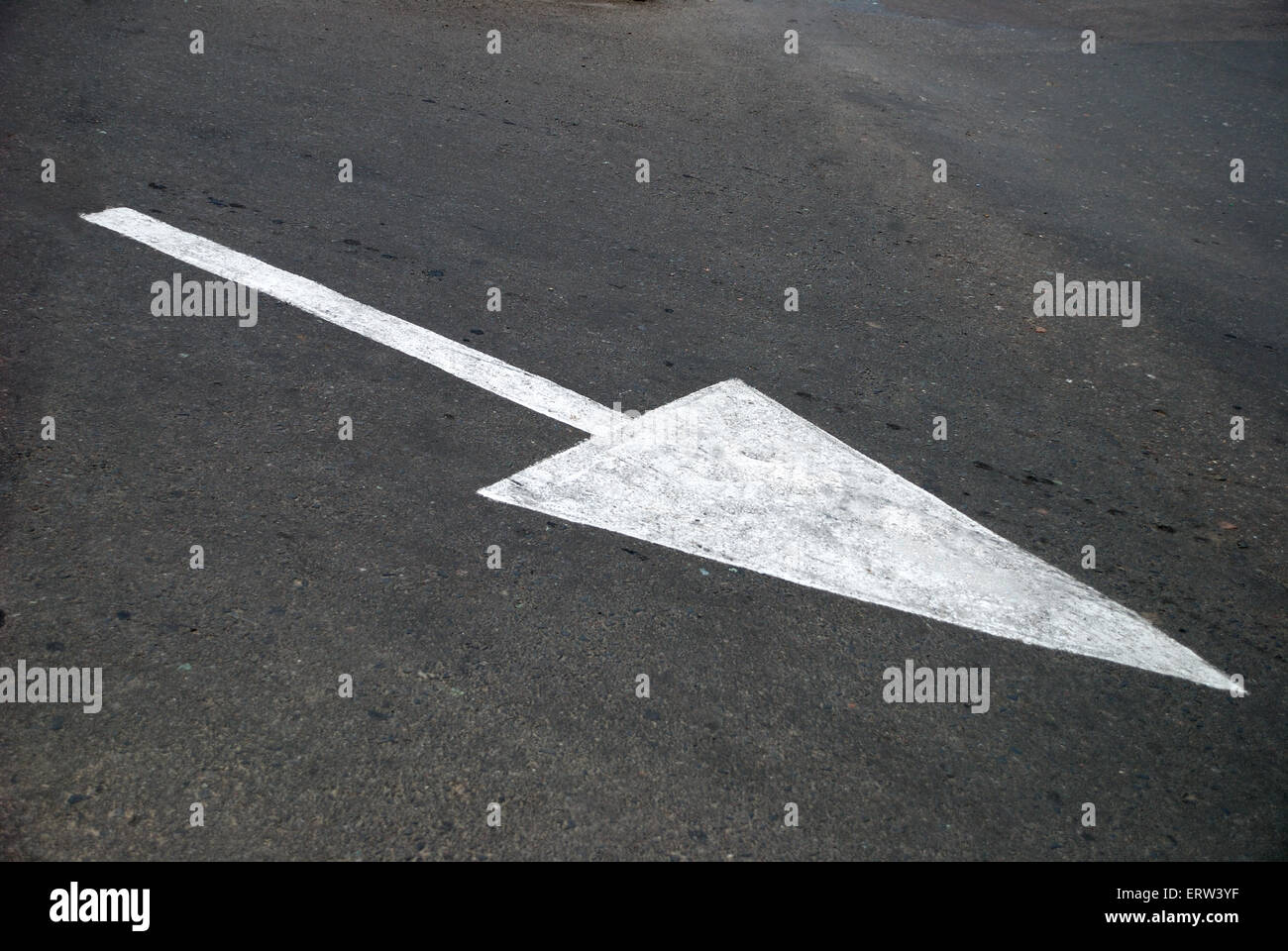 Road marking on asphalt in the form of an arrow Stock Photo - Alamy