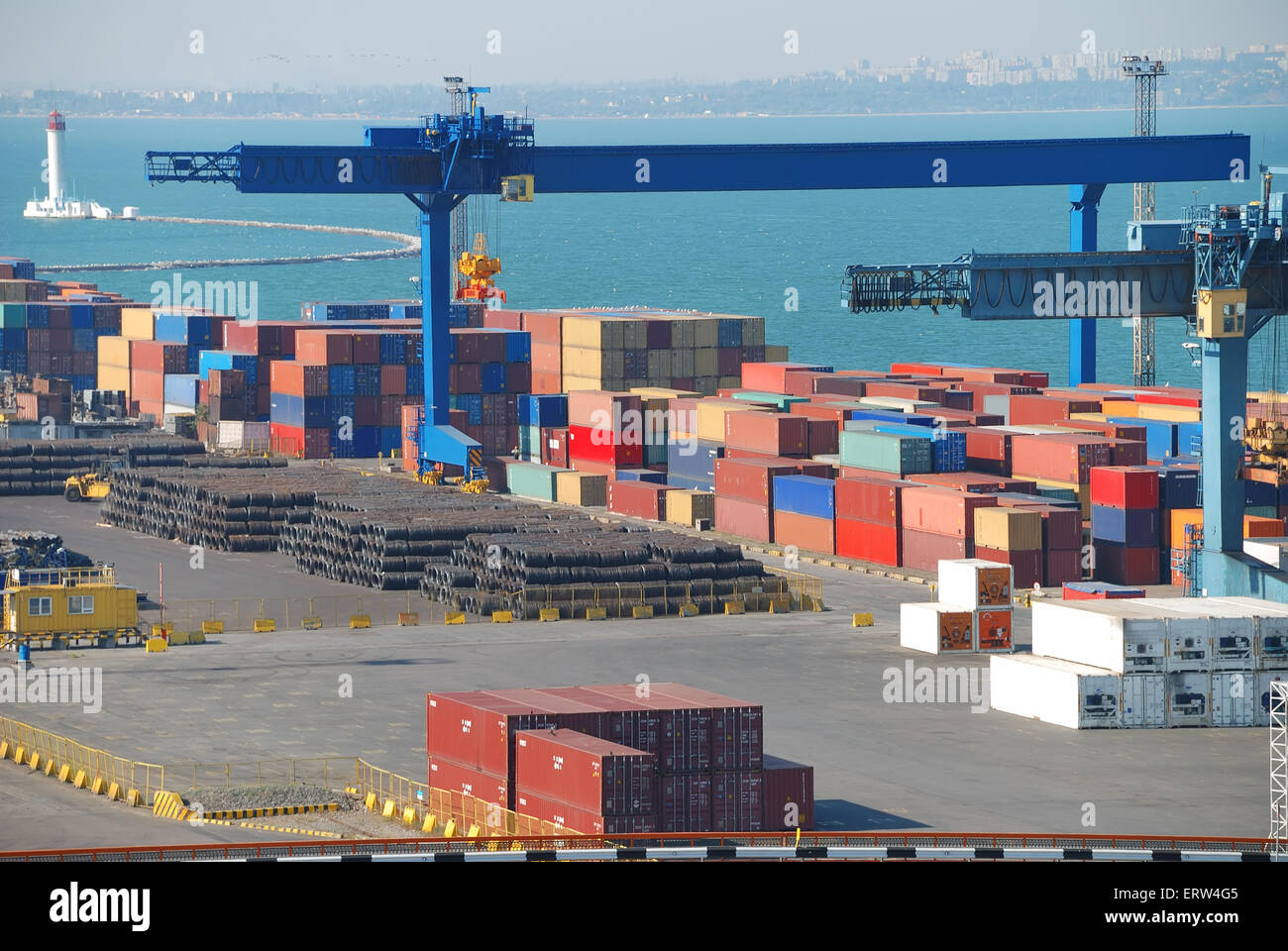 Port warehouse with containers and industrial cargoes Stock Photo - Alamy