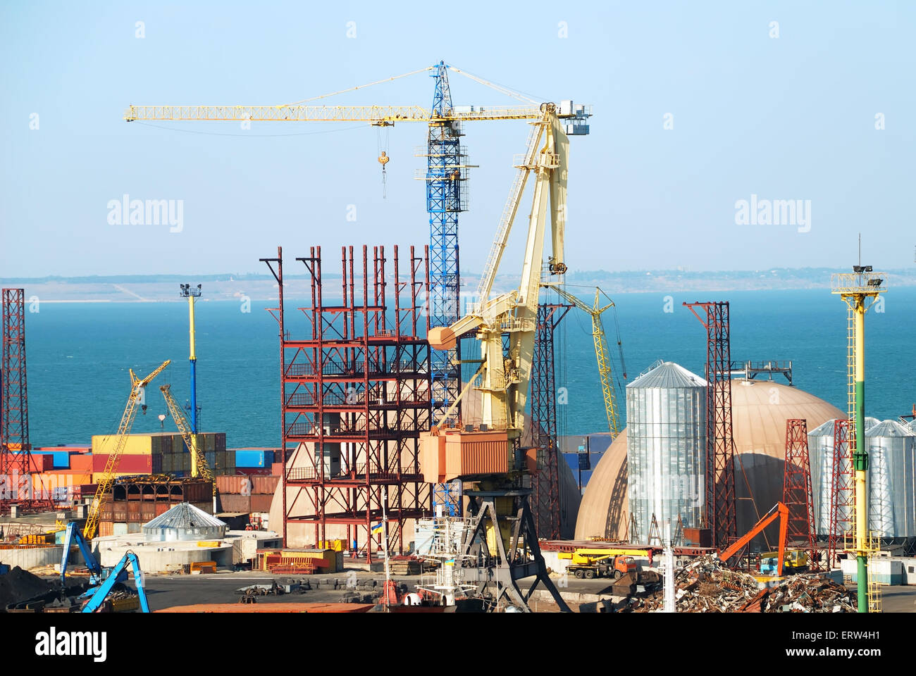 Port warehouse with inustrial cargoes and raw material Stock Photo - Alamy
