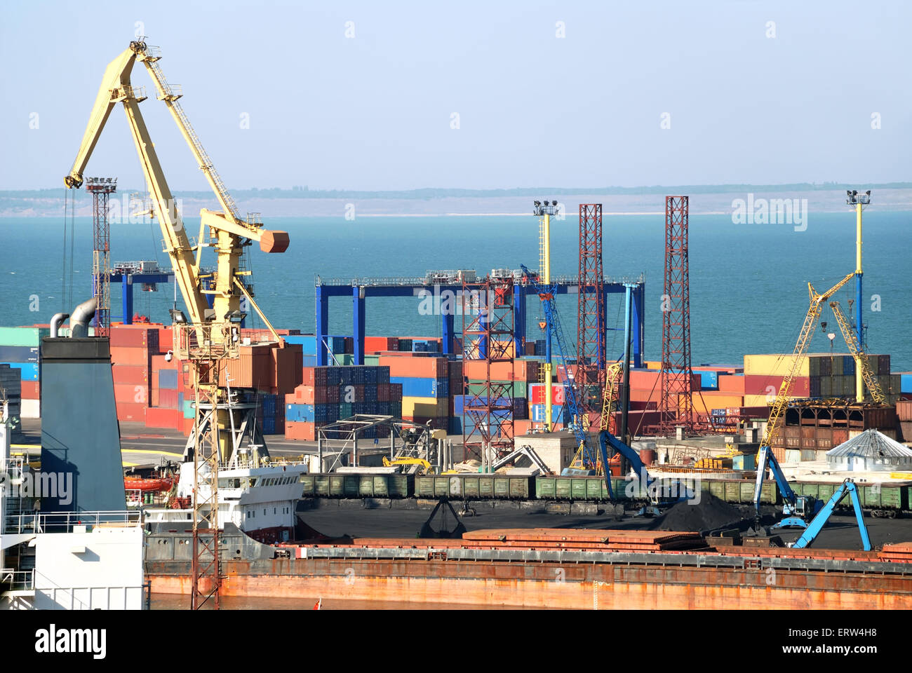 Port warehouse with containers and industrial cargoes Stock Photo - Alamy