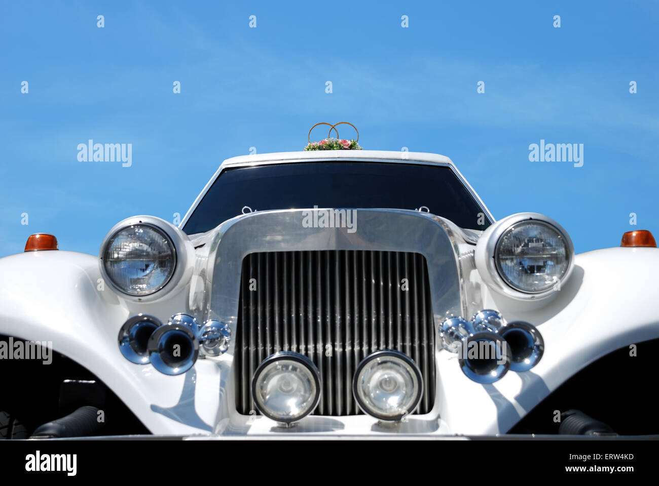 White wedding limousine decorated with flowers Stock Photo - Alamy