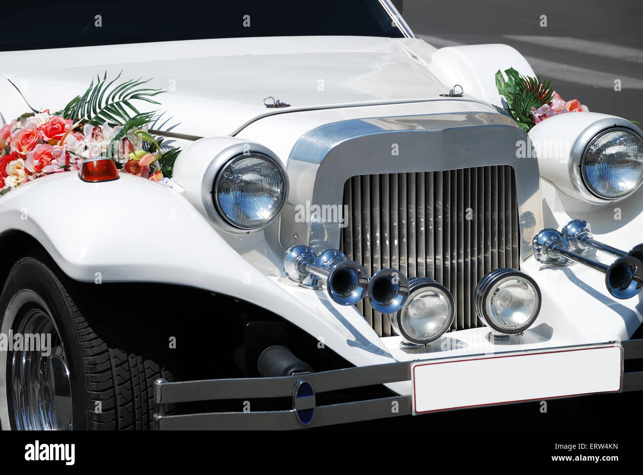 White wedding limousine decorated with flowers Stock Photo - Alamy