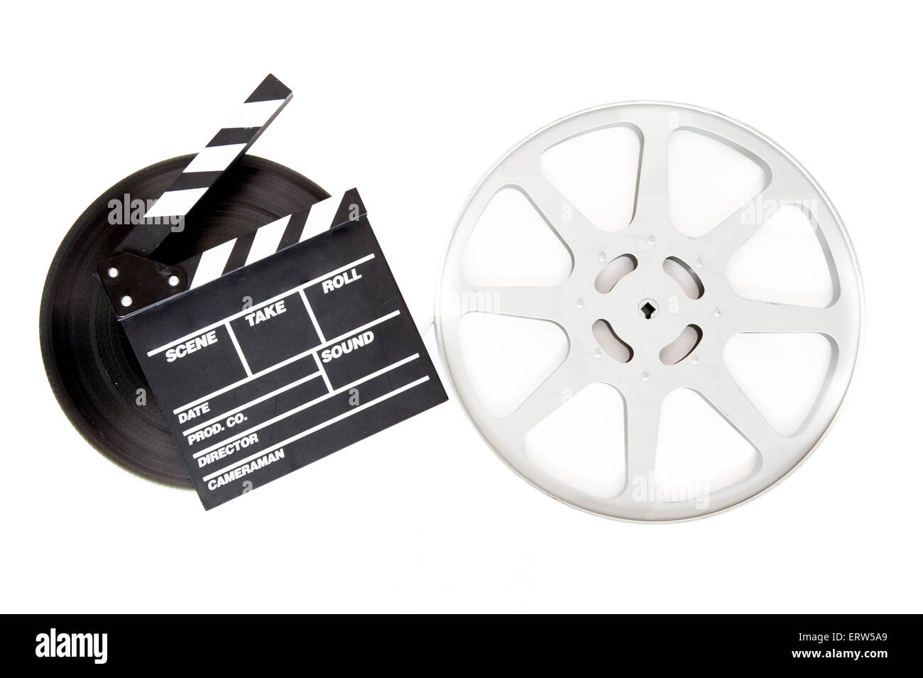 Movie clapper on 35 mm cinema film reels isolated on white background ...