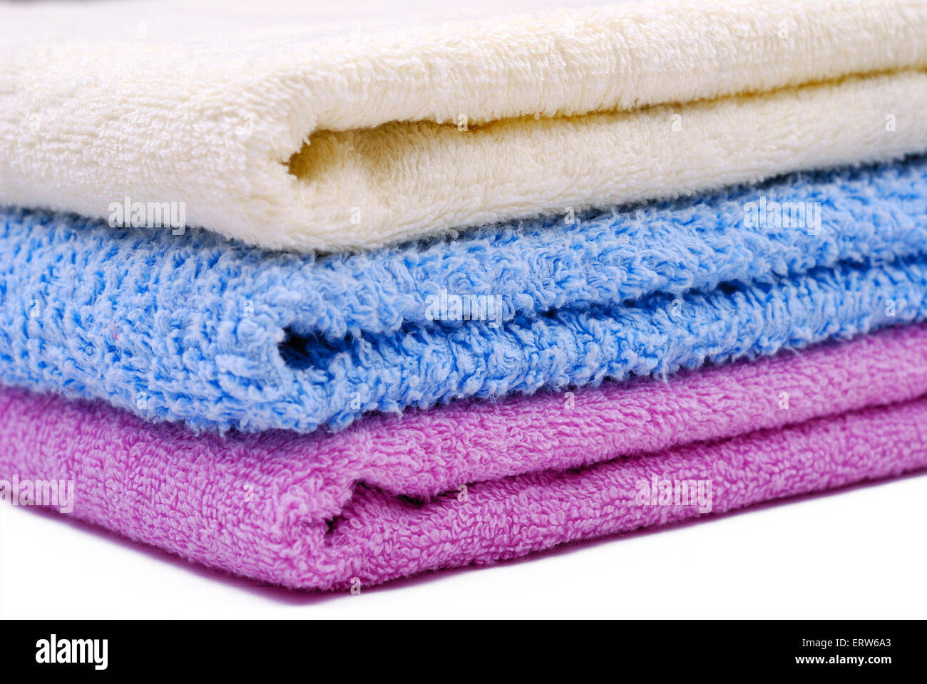 Stack of colorful towels on a white background Stock Photo - Alamy