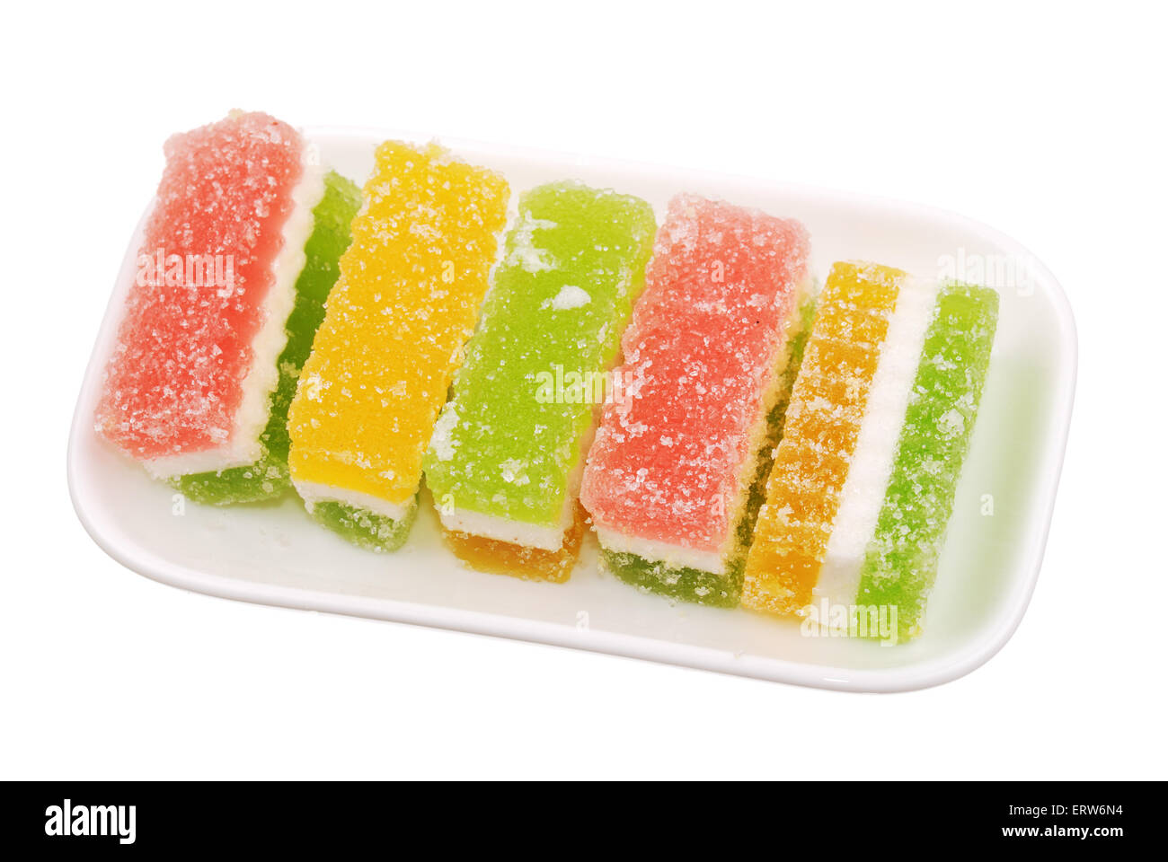 Fruit candy slices on plate isolated Stock Photo - Alamy