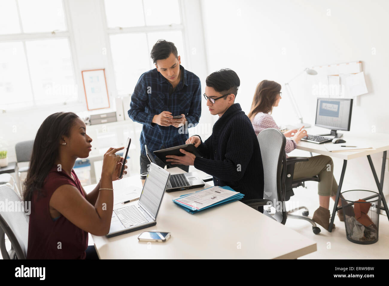 Business people using technology in office Stock Photo - Alamy