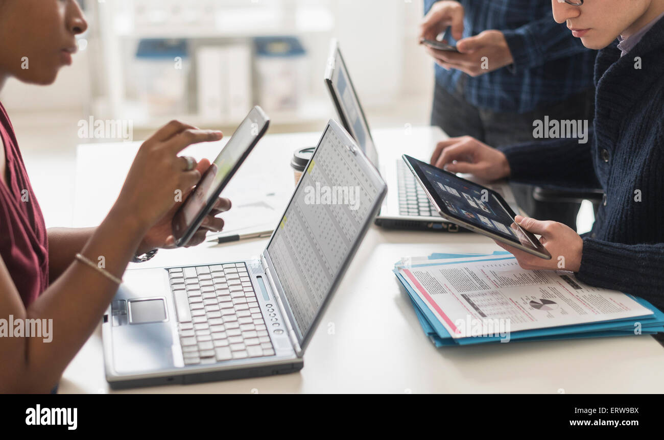 Business people using technology in office Stock Photo - Alamy