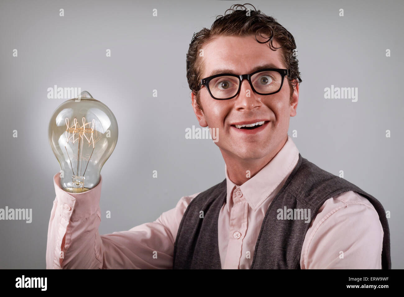Nerdy four eyed businessman is happy about his new idea Stock Photo - Alamy