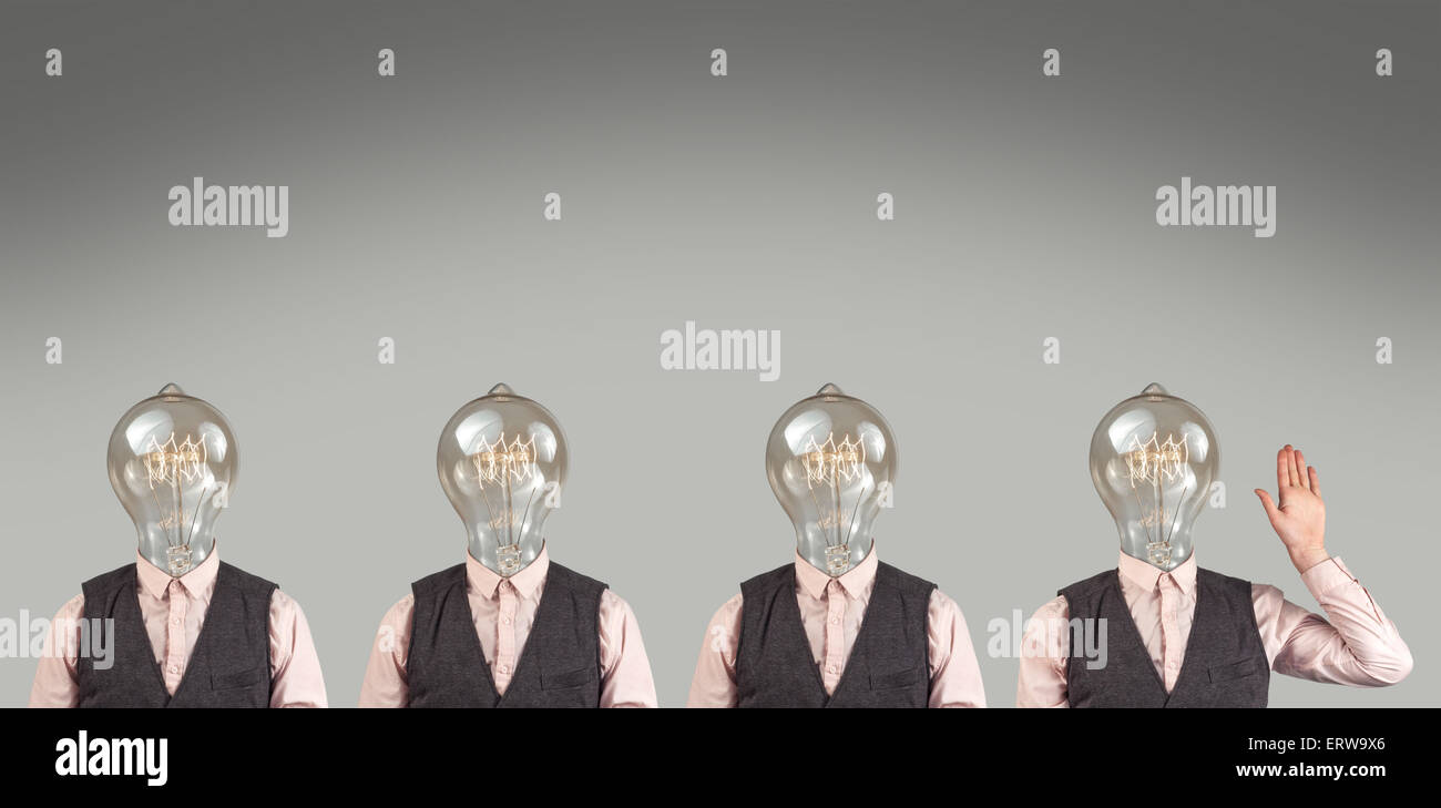 Lightbulb head businessmen in large group business meeting Stock Photo ...