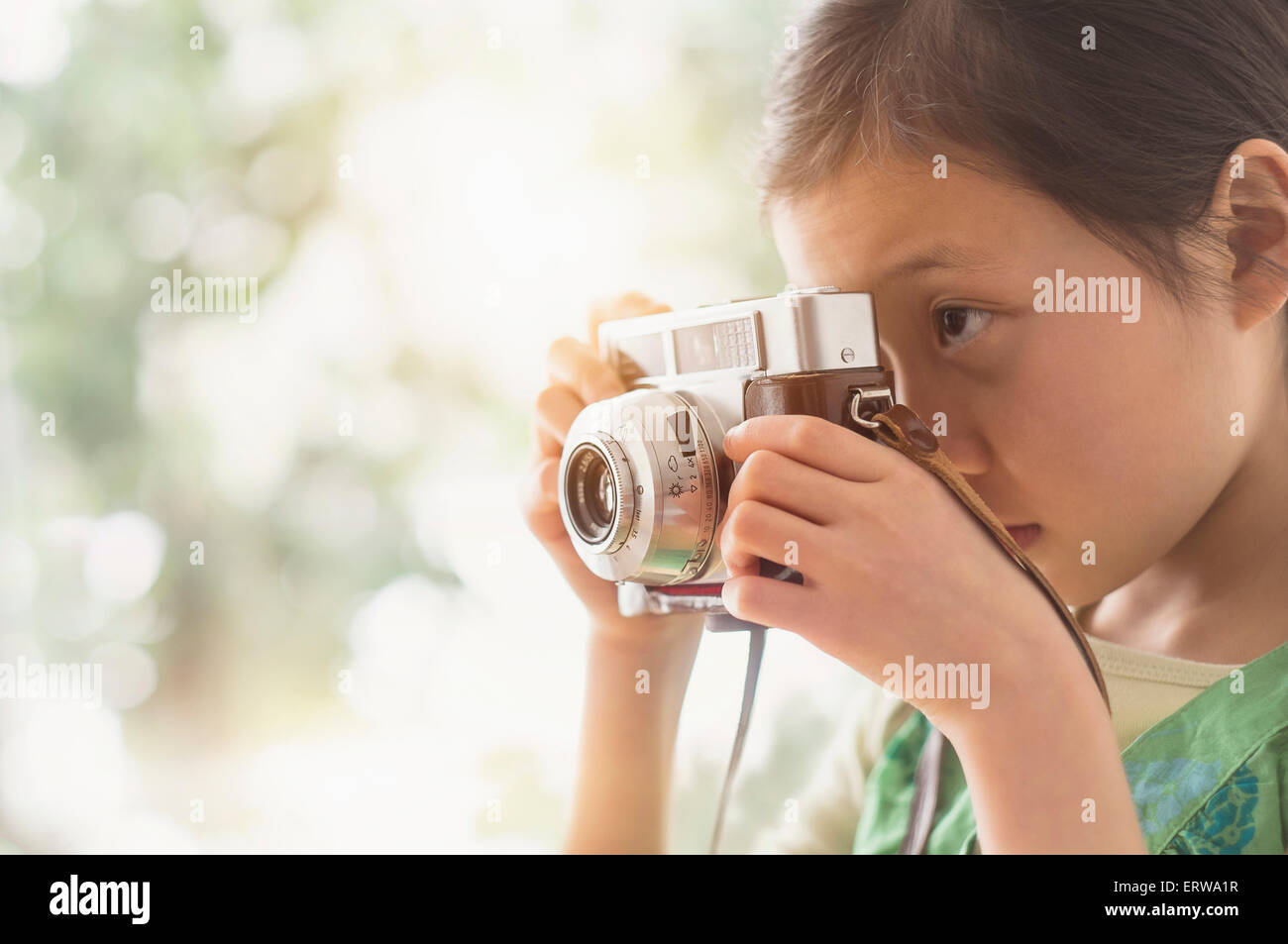 Chinese girl photographing with vintage camera Stock Photo - Alamy