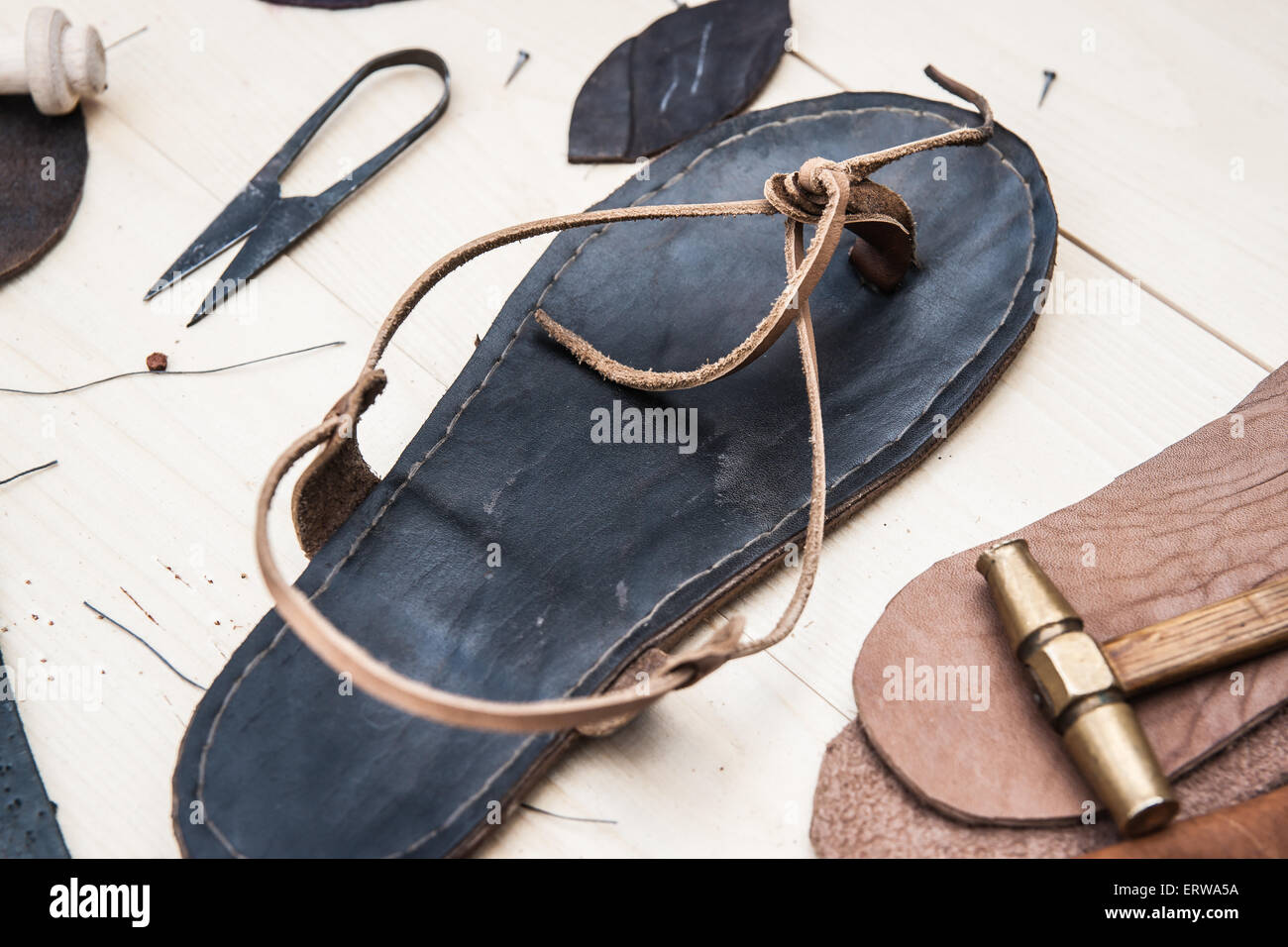 Making of ancient leather sandals using the antique technology Stock ...