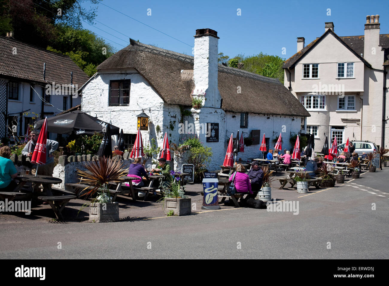 the ship inn in Porlock weir Somerset with people sat on seats at ...