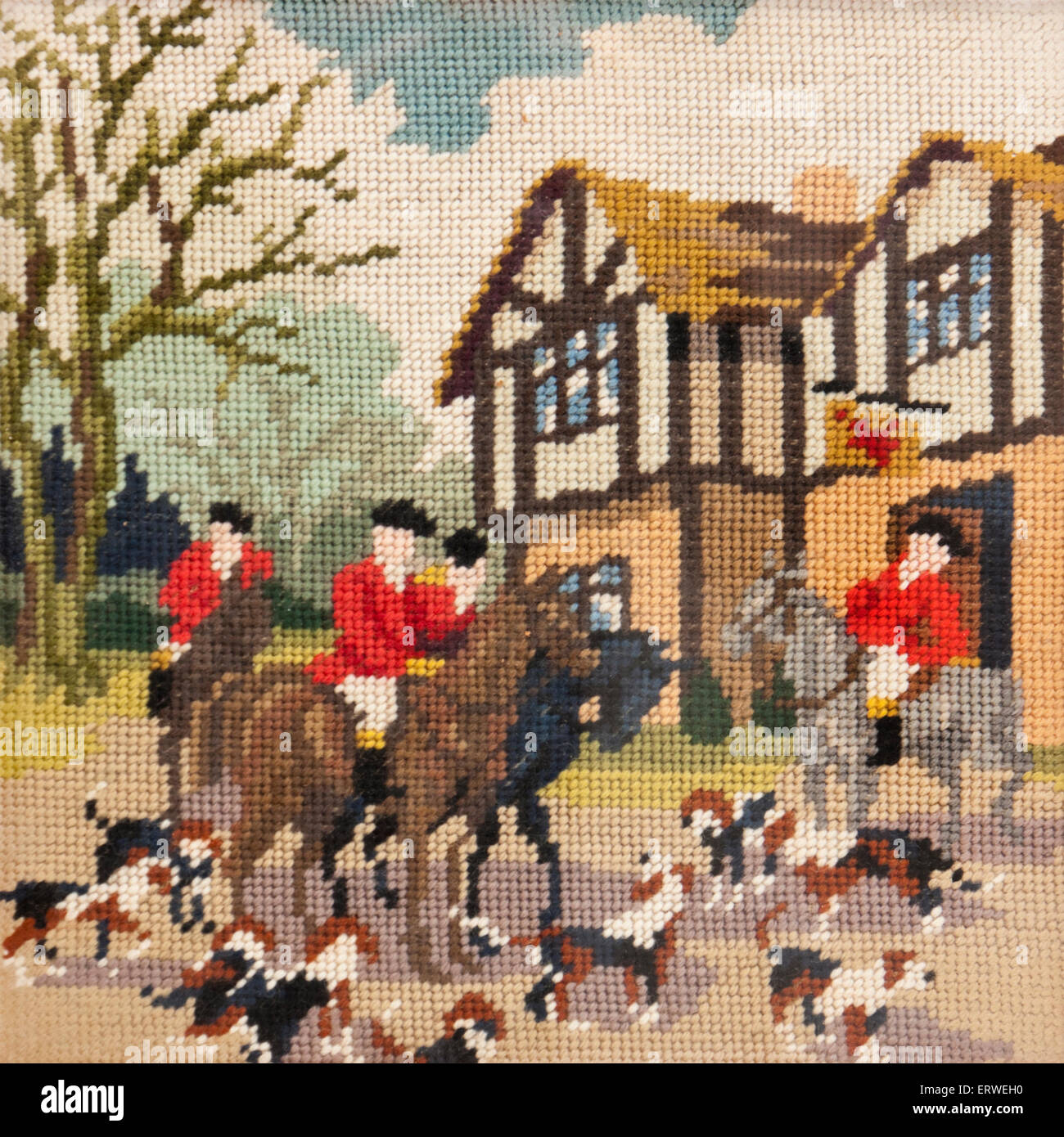 Cross stitch / needlework of a fox hunting scene in a village Stock ...